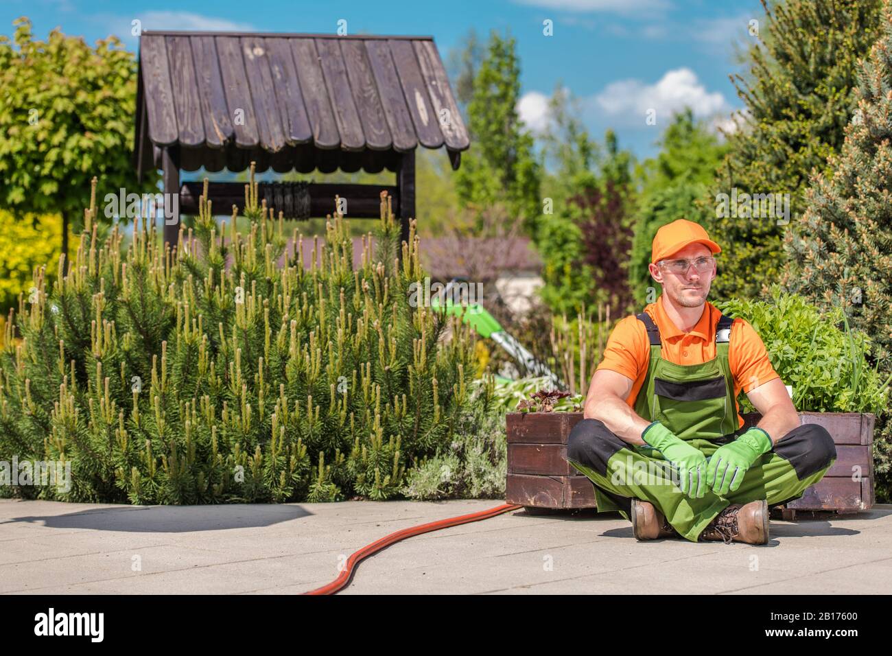 Men Relaxing in His Garden. Professional Garden Enjoying the Moment ...