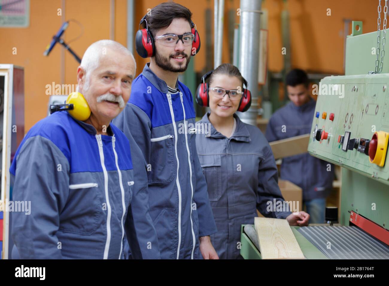 woodworking apprentice posing and smiling with teacher Stock Photo - Alamy