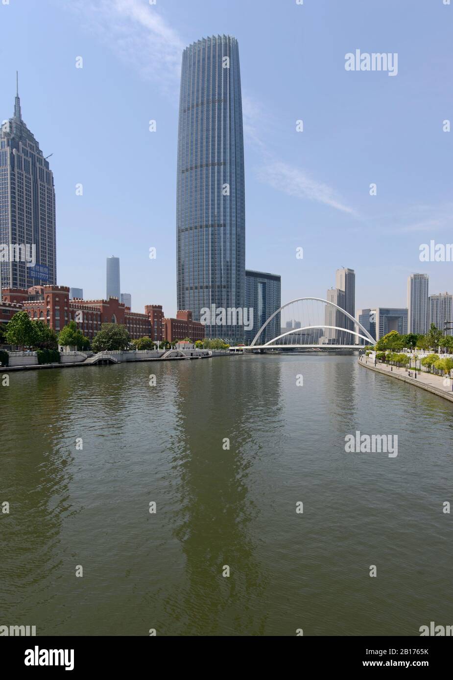 View across Haihe river to Tianjin World Finance Center and Dagu bridge ...