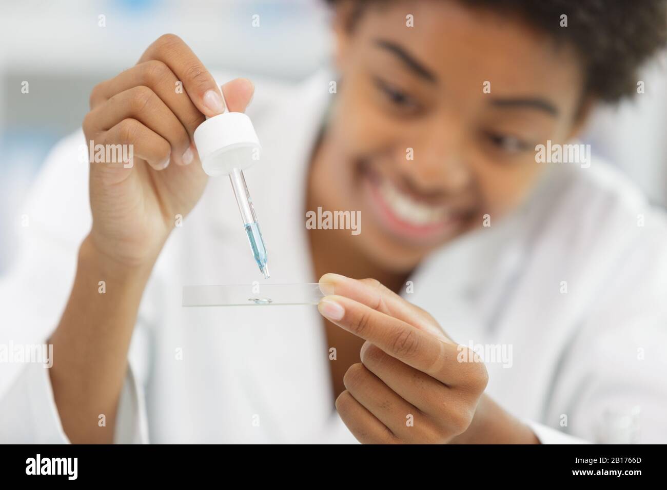 scientist making observation of the bottle of chemical Stock Photo - Alamy