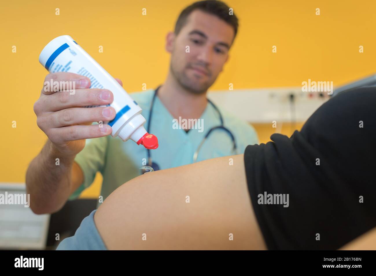 doctor squeezing from tube gel for procedure of ultrasound Stock Photo ...
