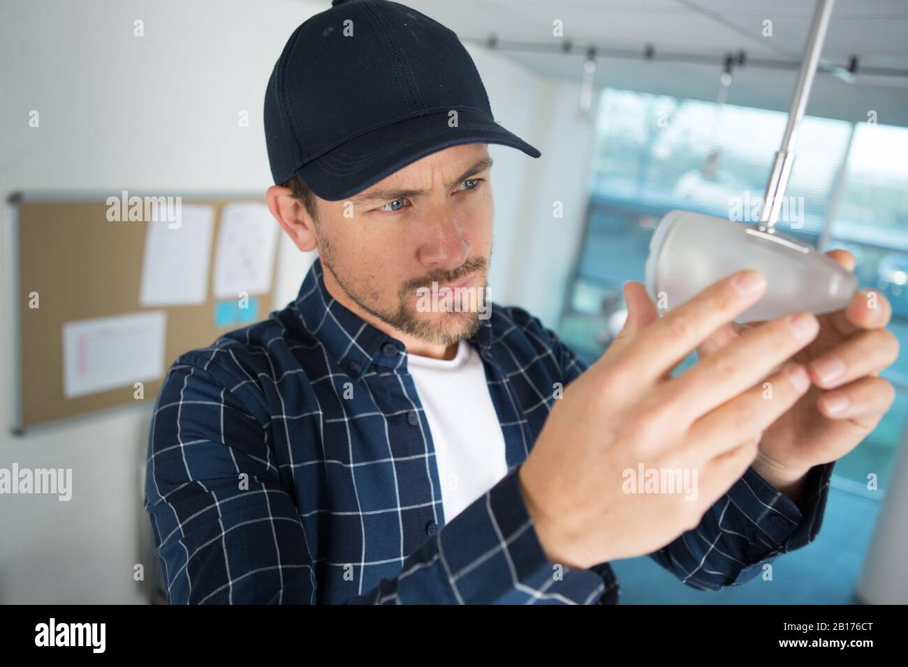 man fixing light at home Stock Photo - Alamy