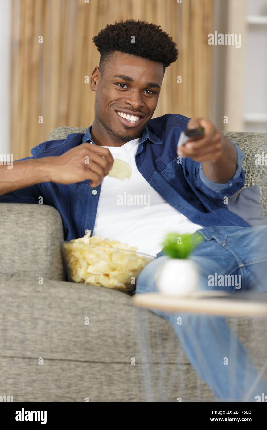 Young cheerful man eating potato hi-res stock photography and images ...