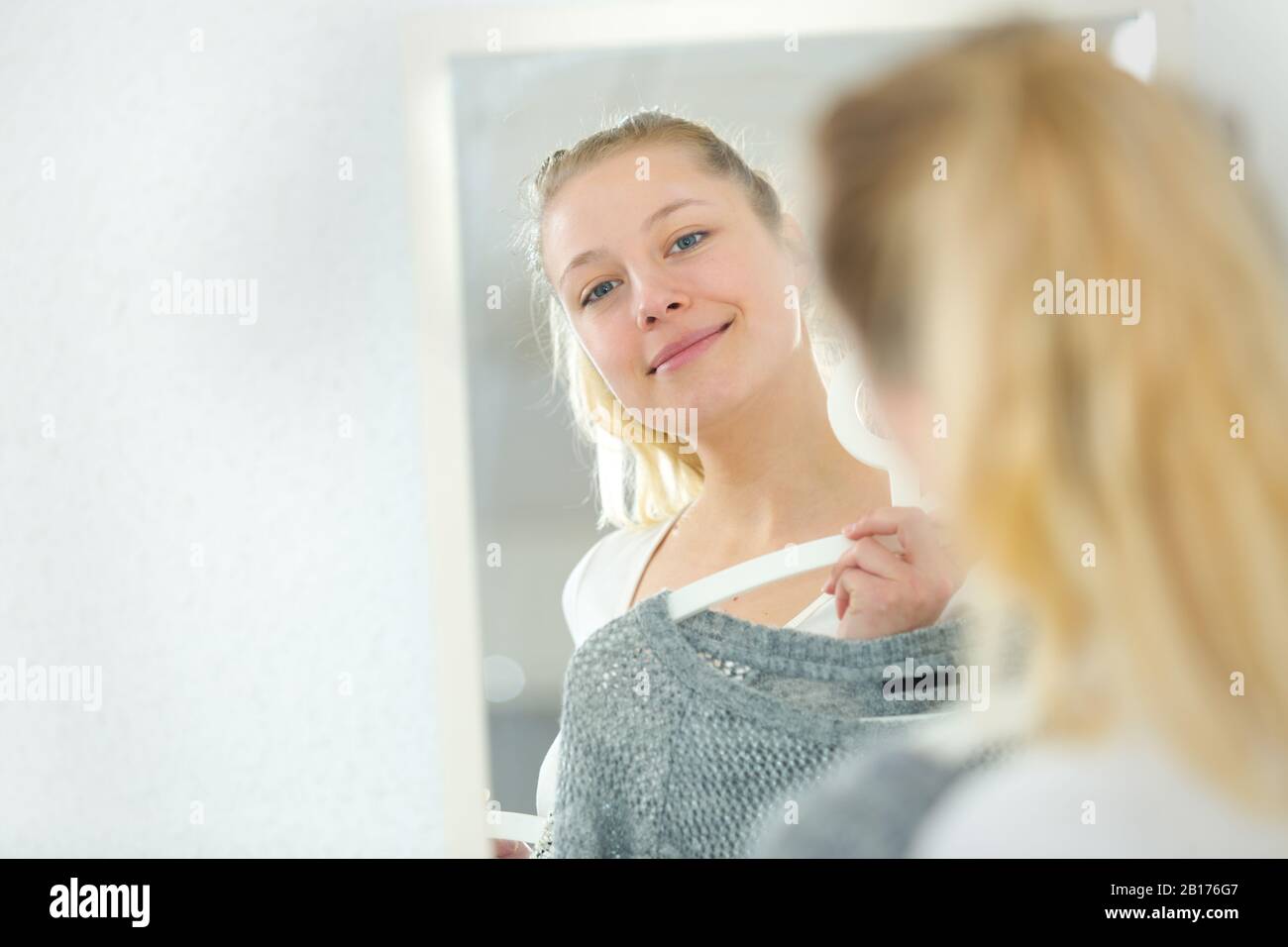 Girl trying on clothes hi-res stock photography and images - Alamy