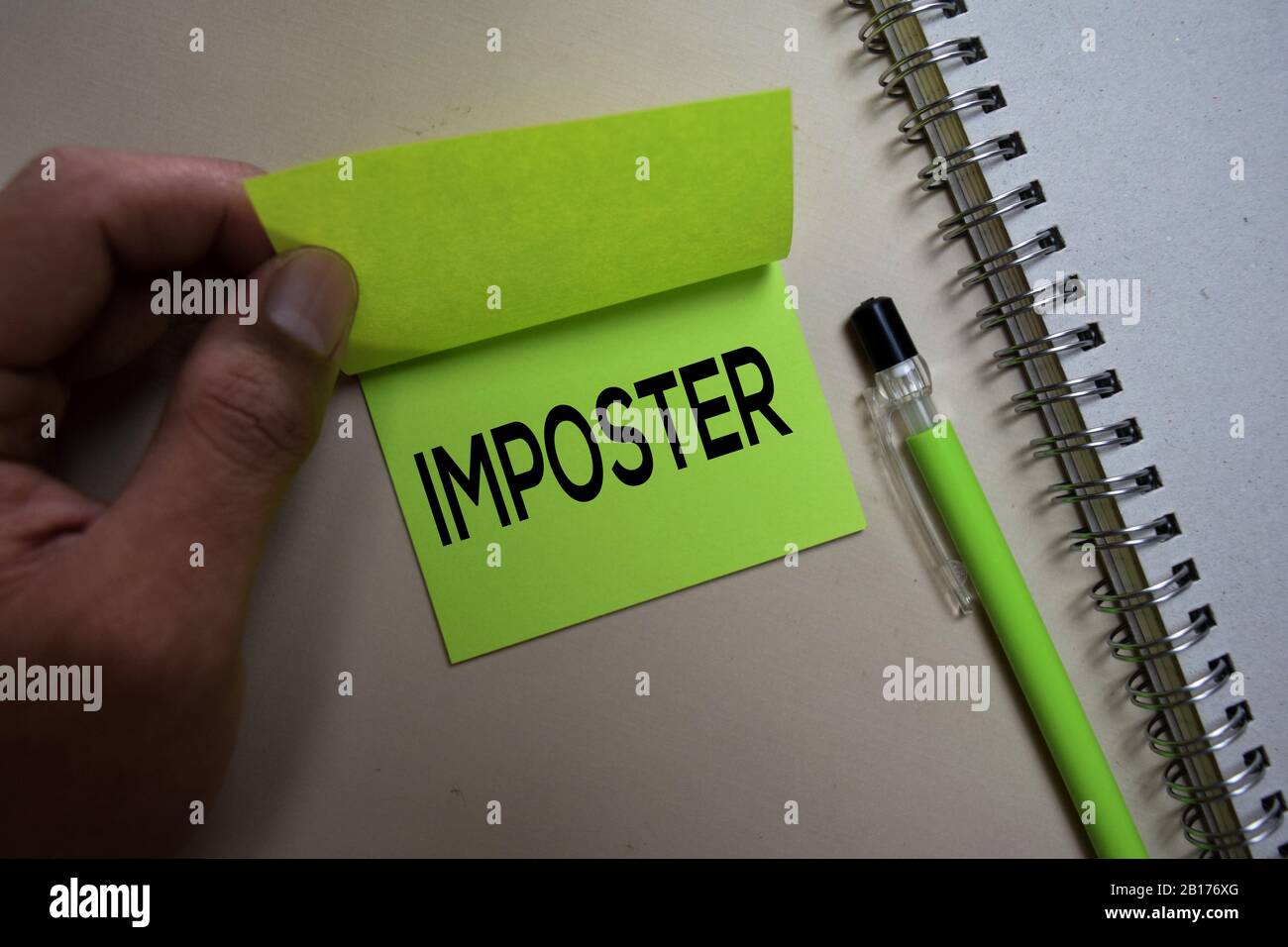 Imposter text on sticky notes isolated on office desk Stock Photo - Alamy