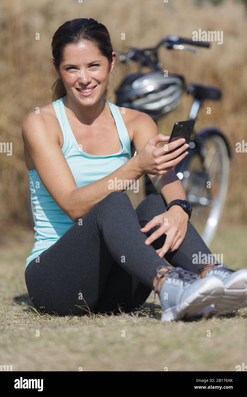 woman cyclist resting making pause Stock Photo - Alamy