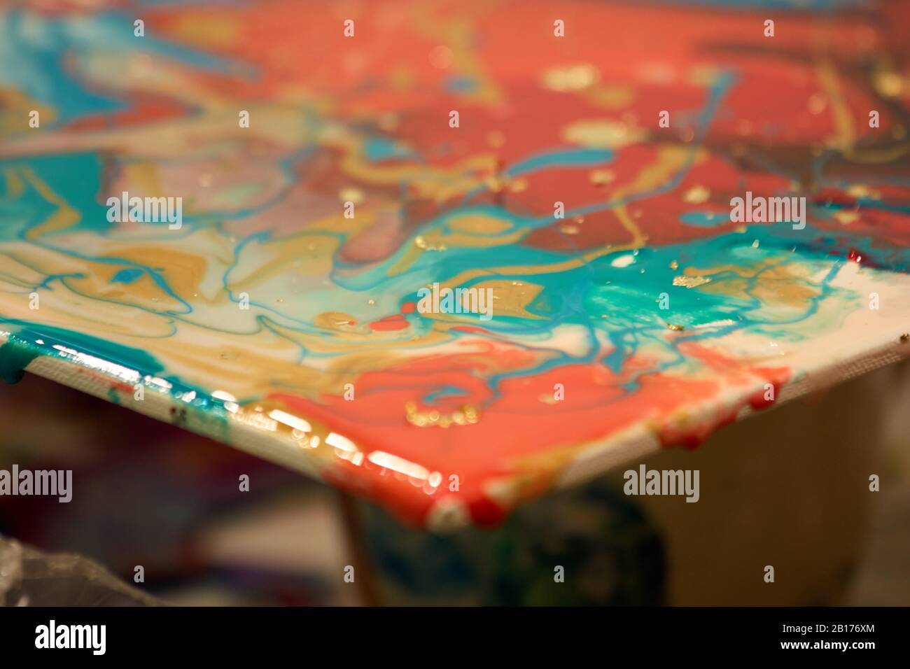 Red, blue and yellow paint mixed on a textile canvas Stock Photo - Alamy