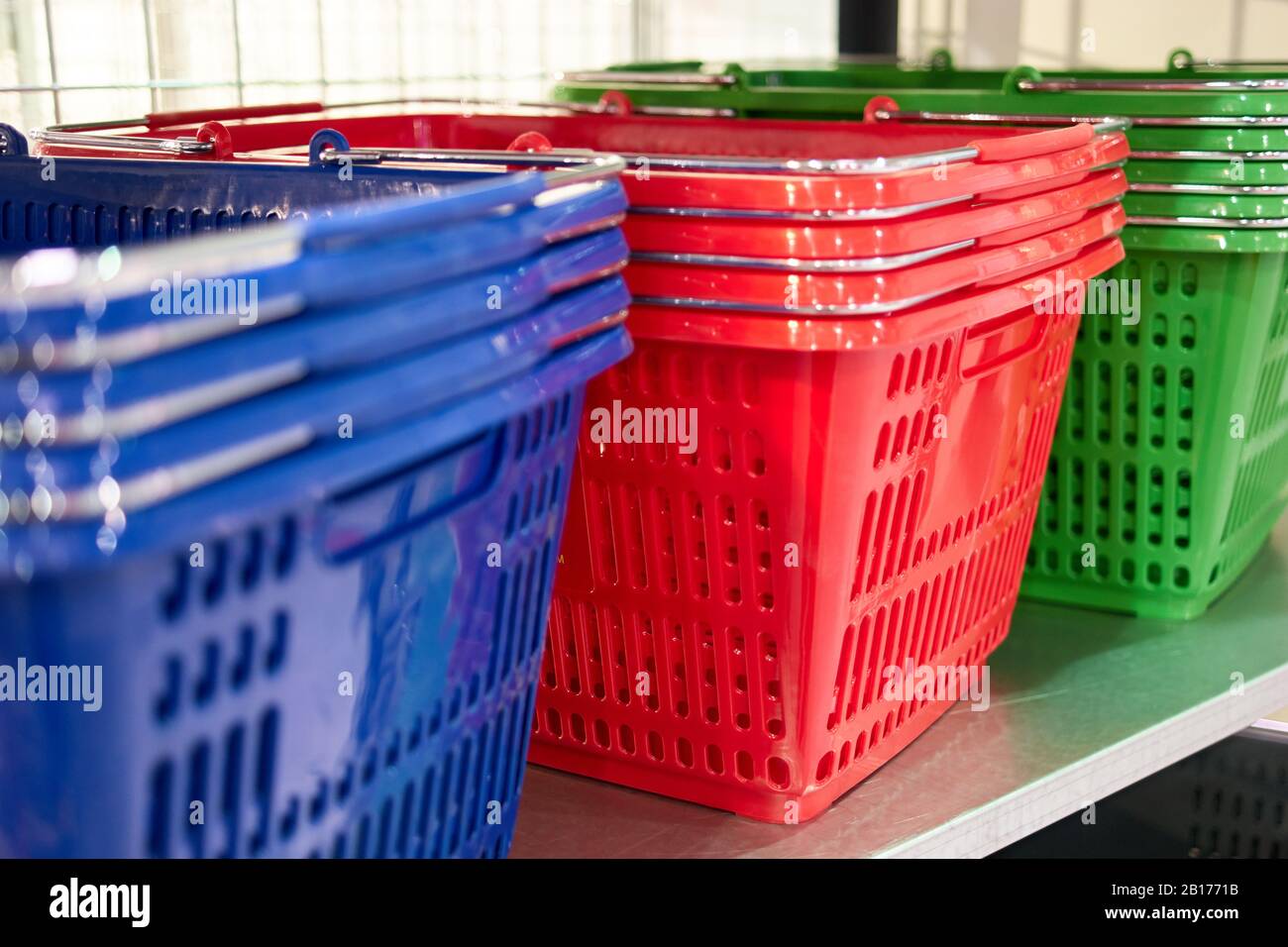 Stacks of empty shopping baskets Stock Photo - Alamy