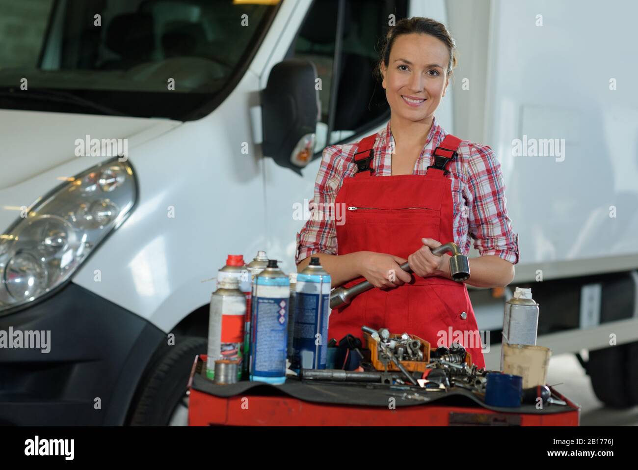 Beautiful female mechanic holding wrench hi-res stock photography and ...