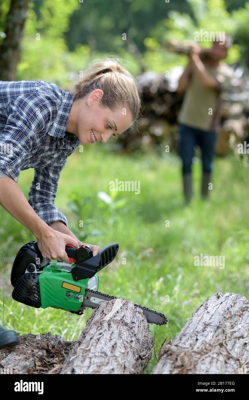 Woman chopping wood hi-res stock photography and images - Alamy
