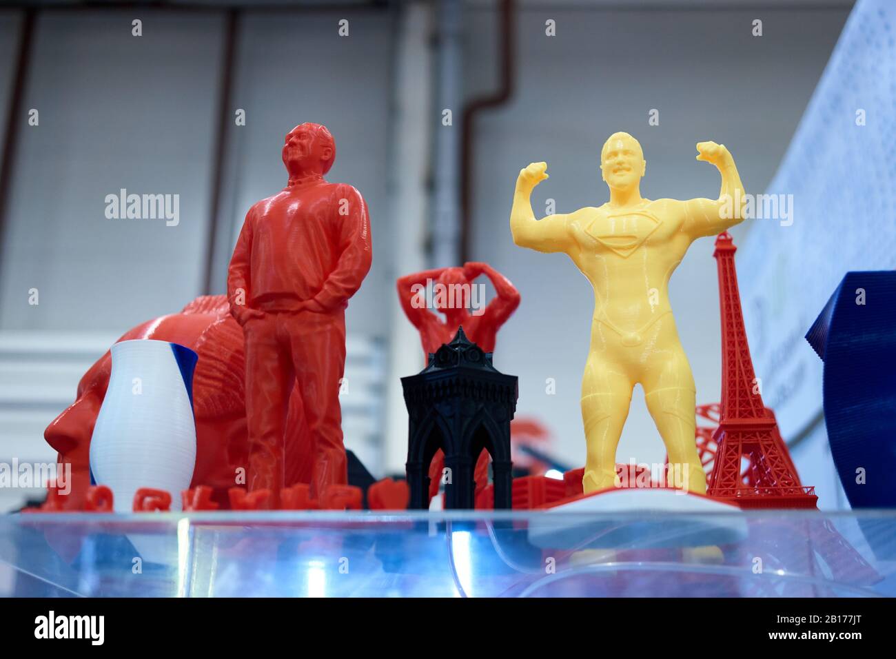 Strong men and towers printed on a 3d printer Stock Photo - Alamy