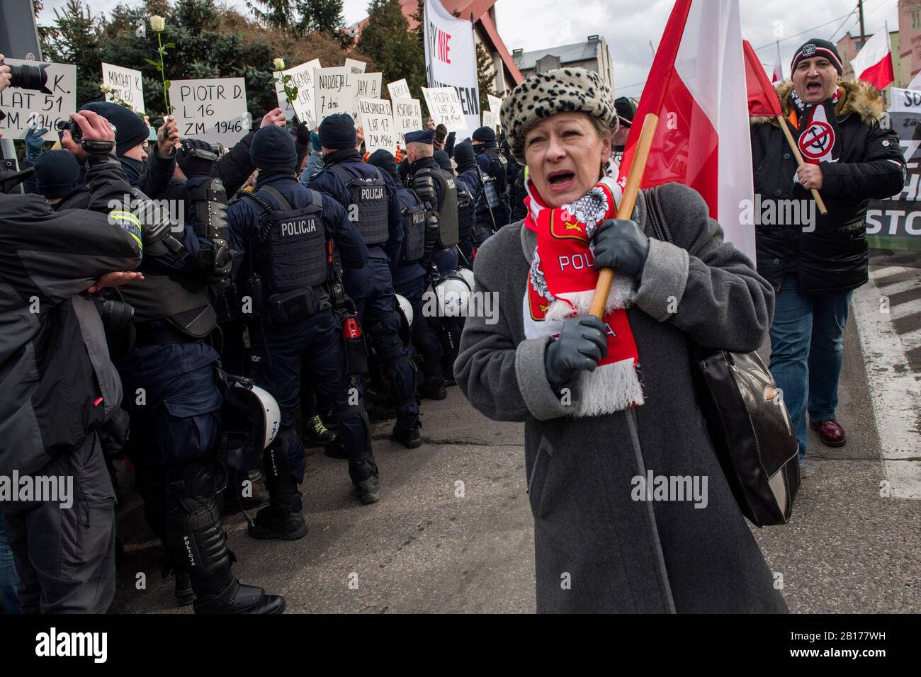A protester shouts slogans while holding a Polish flag during the ...