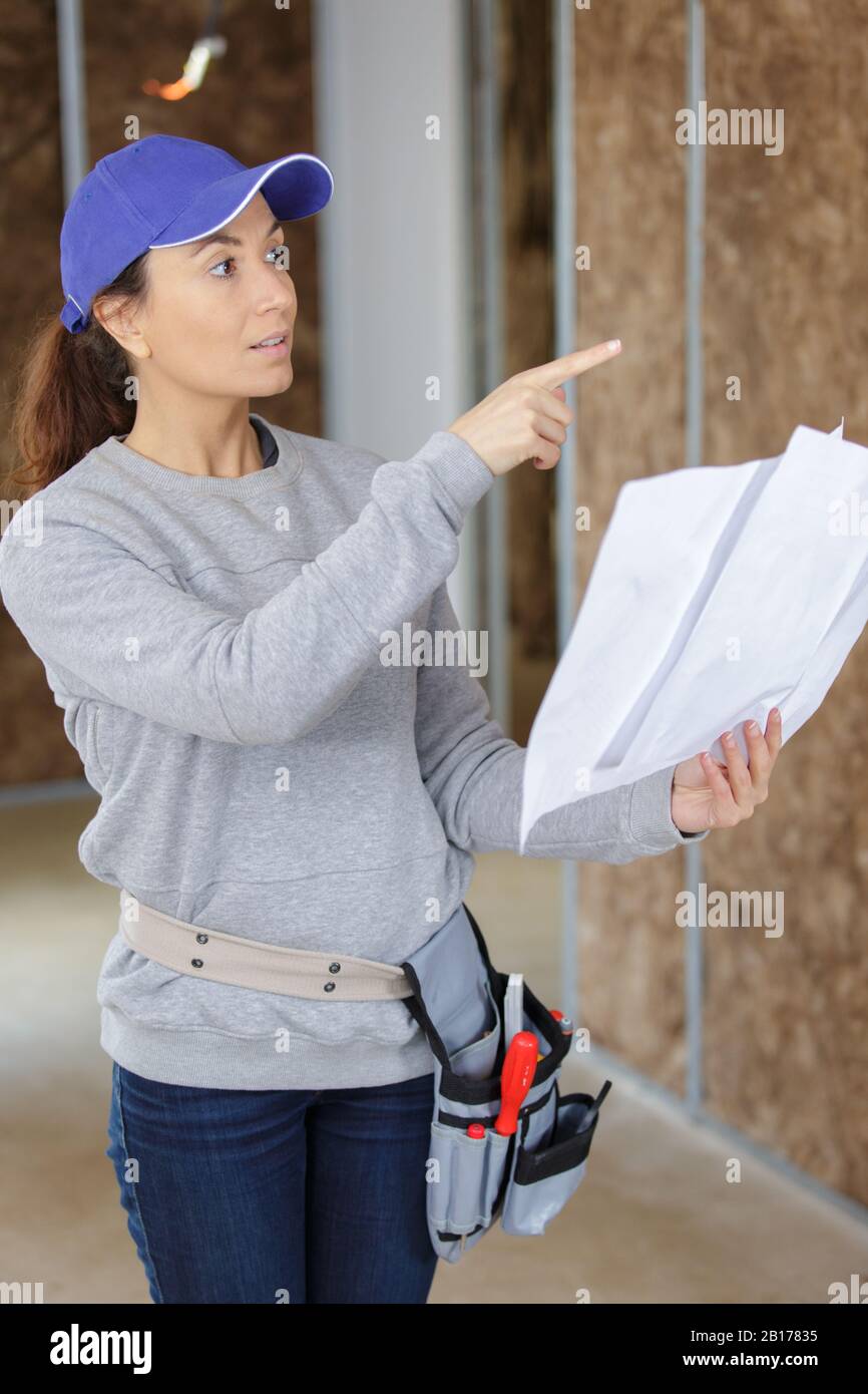 Woman pointing finger housing hi-res stock photography and images - Alamy