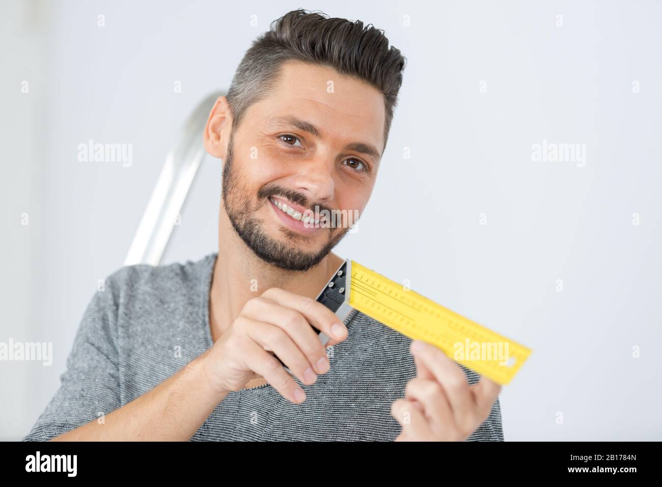 Man doing diy hi-res stock photography and images - Alamy