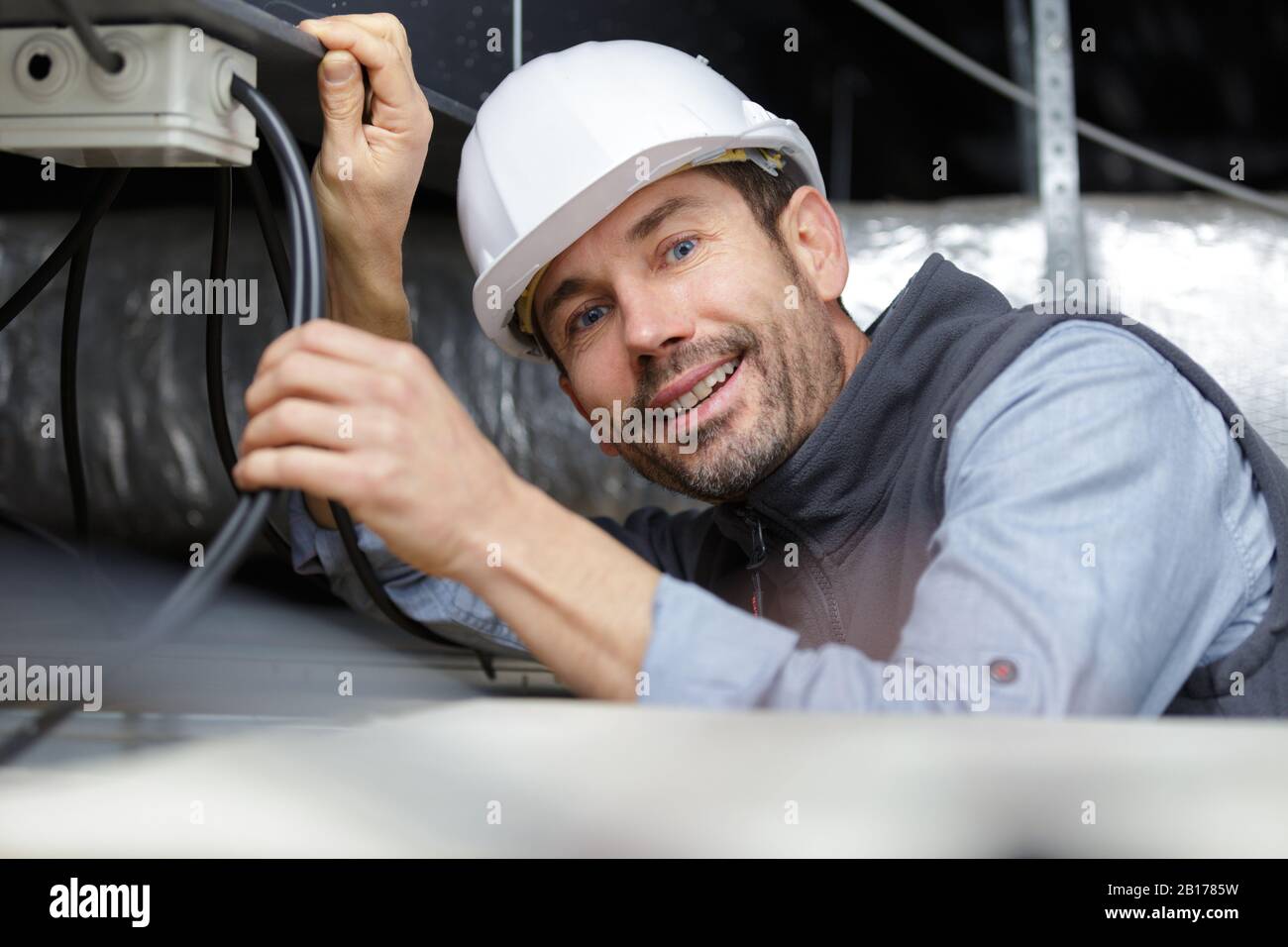 engineer working with cables indoors Stock Photo - Alamy