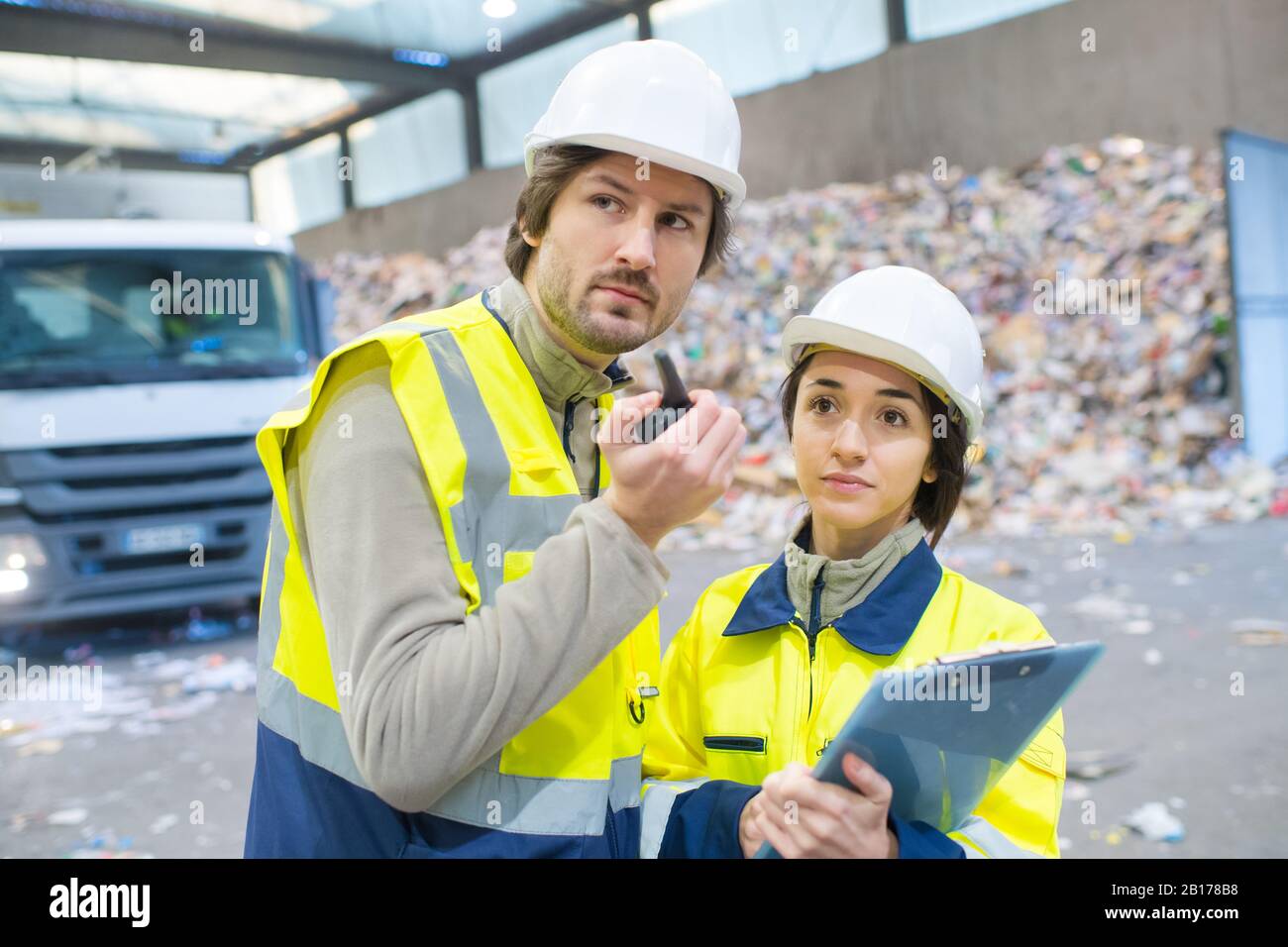 sanitation workers working in recycling plant Stock Photo - Alamy