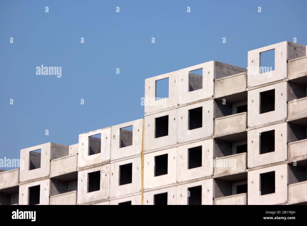Unfinished skyscraper under construction Stock Photo - Alamy