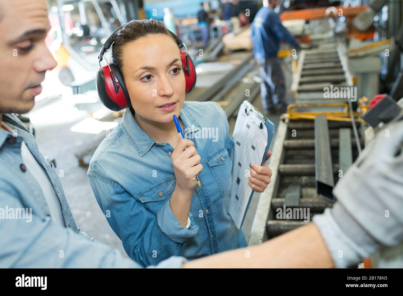 professional inspecting the machinery in the factory Stock Photo - Alamy