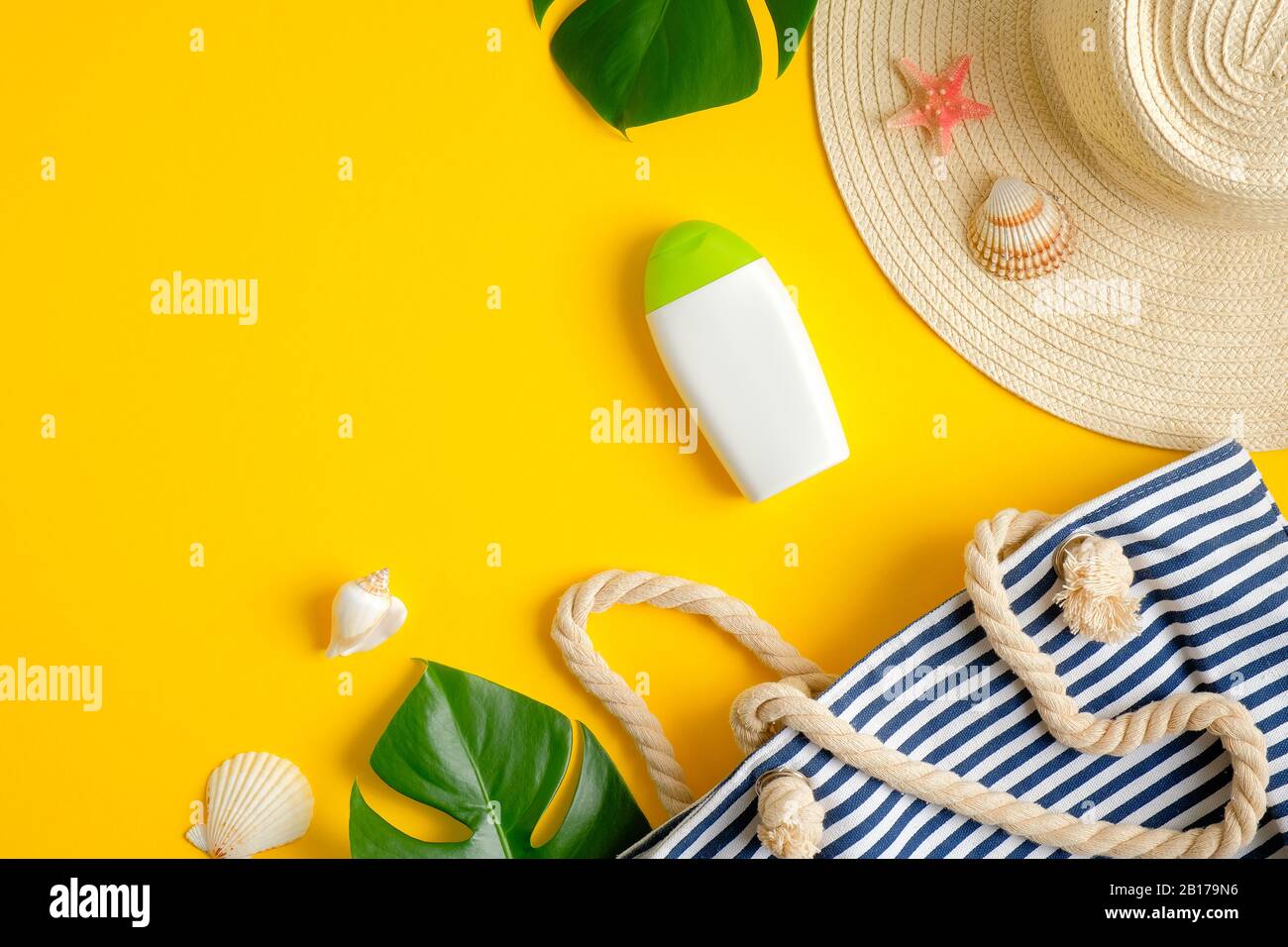 Moisturizer sunscreen lotion bottle without labels, striped beach bag, tropical leaves, female ...