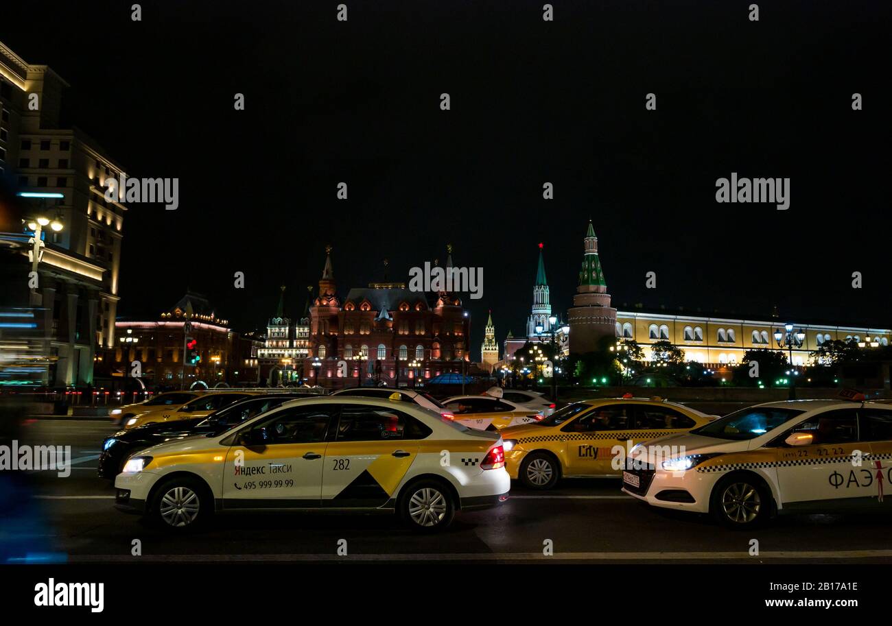 Traffic at night, Manezhnaya Square with Kremlin Towers & State Museum ...
