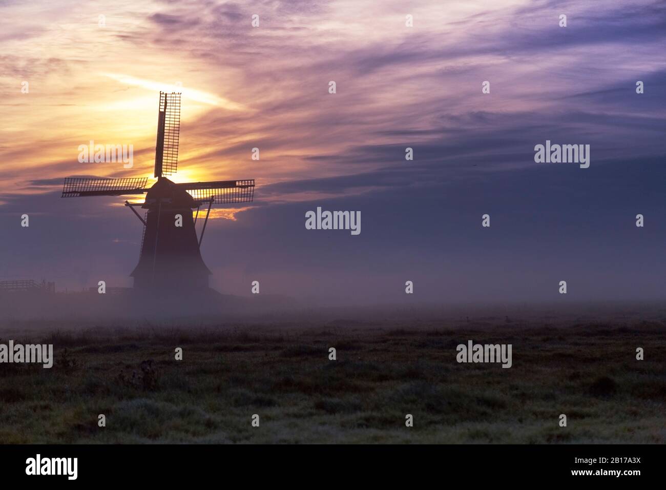 Hempenserpoldermolen smock mill in morning fog, Netherlands, Frisia ...
