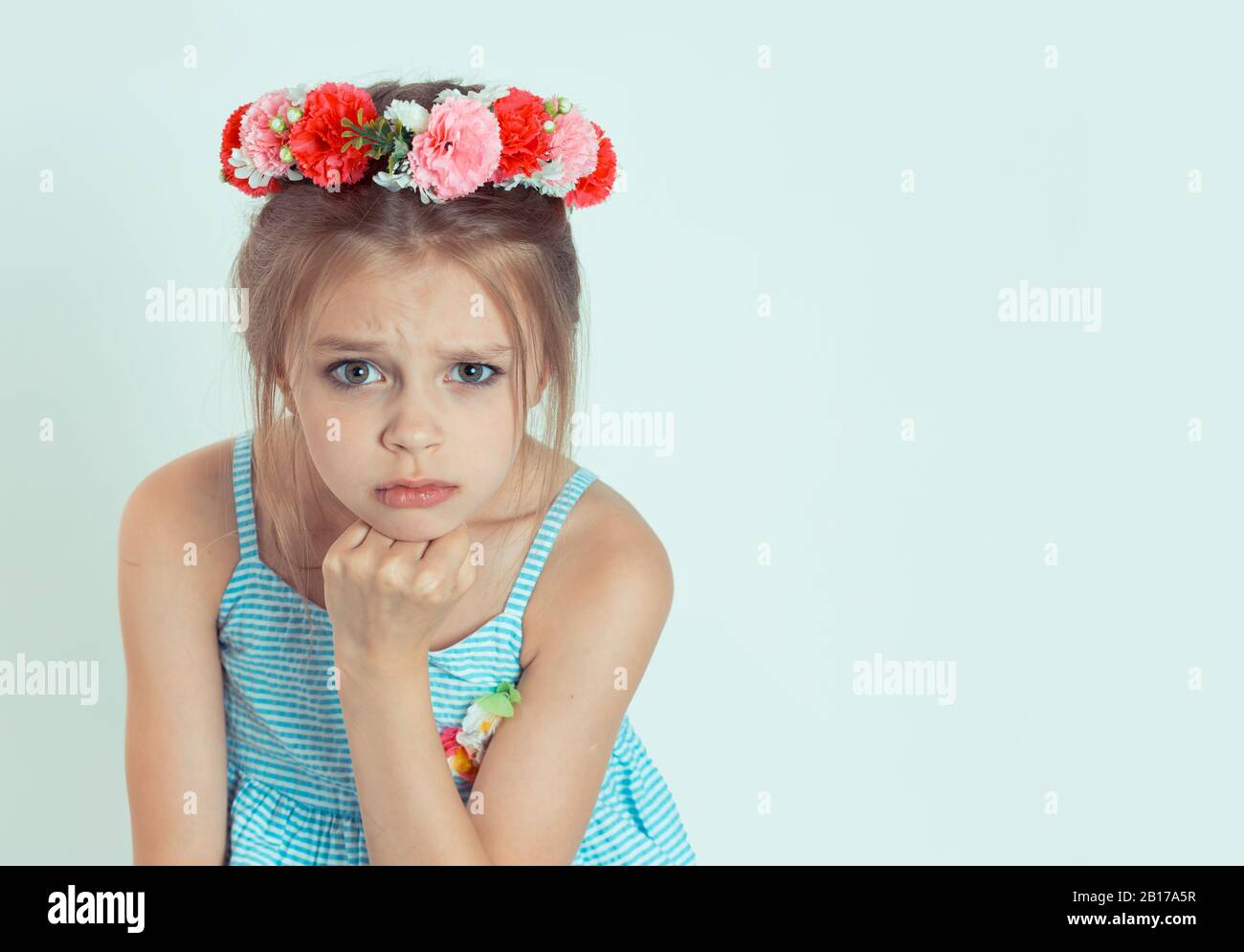 Woman looking skeptical at you, camera angry or upset look on face ...