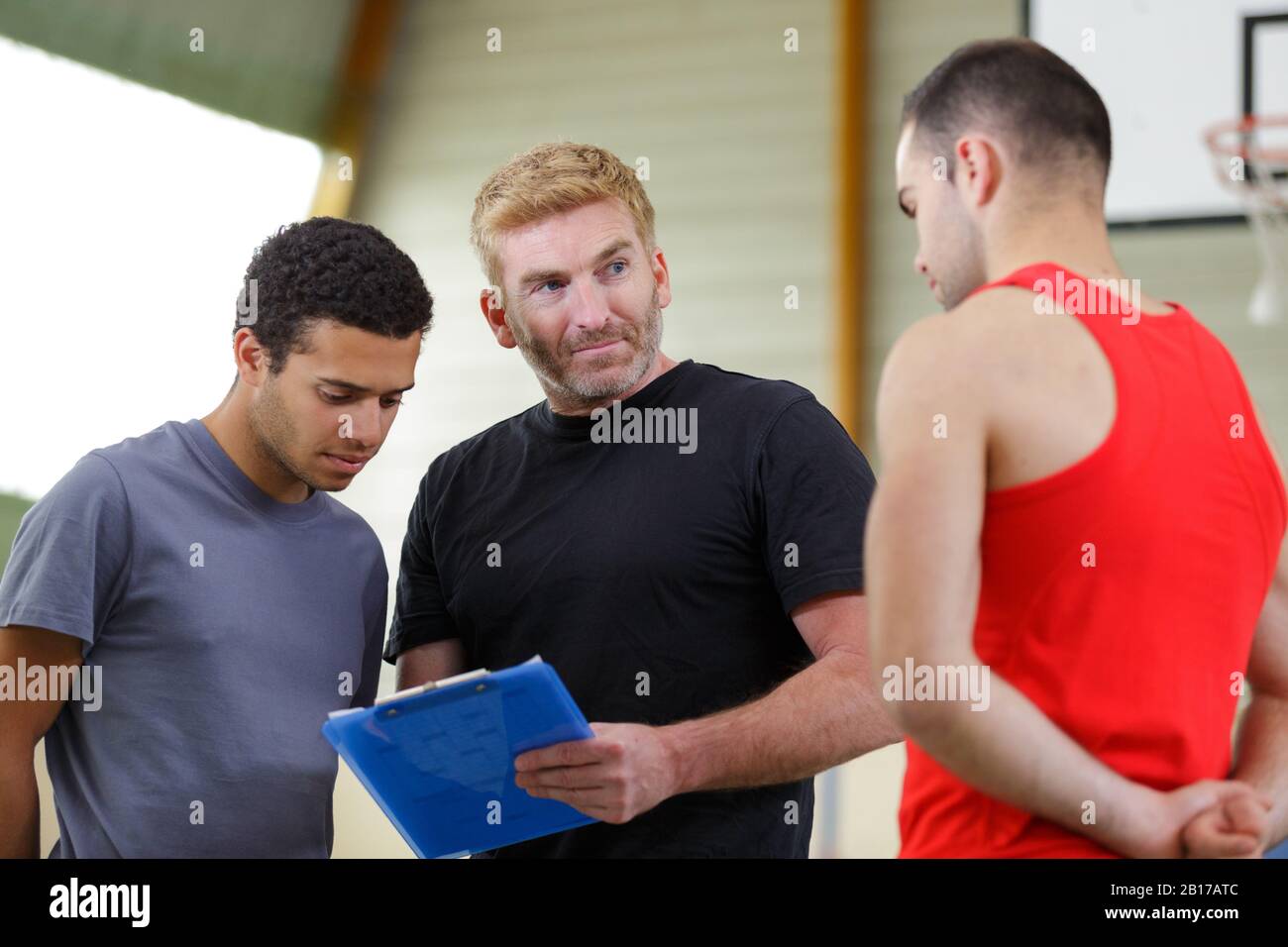portrait of basketball coach with clipboard Stock Photo - Alamy