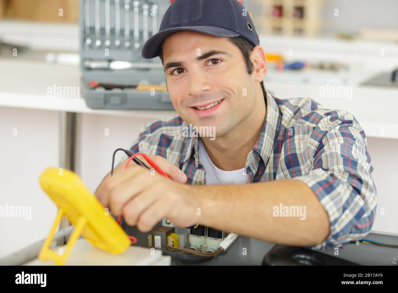 a happy electrician at work Stock Photo - Alamy