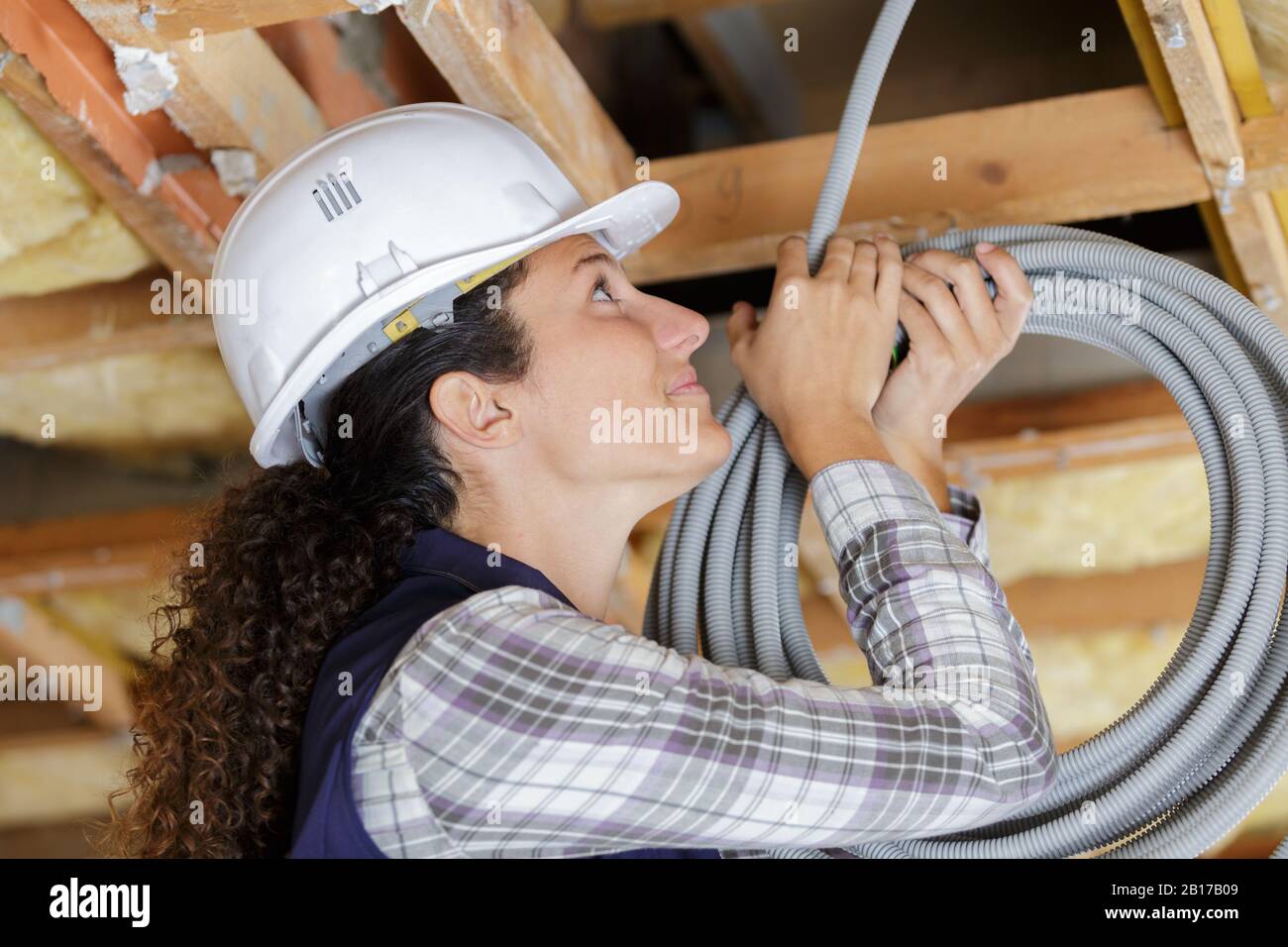 construction worker working with wires Stock Photo - Alamy