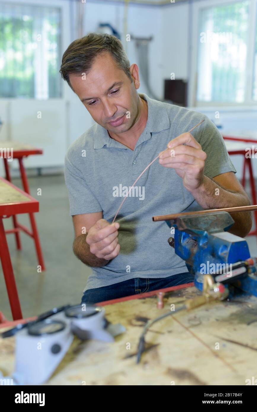 working with cooper wires in workshop Stock Photo - Alamy