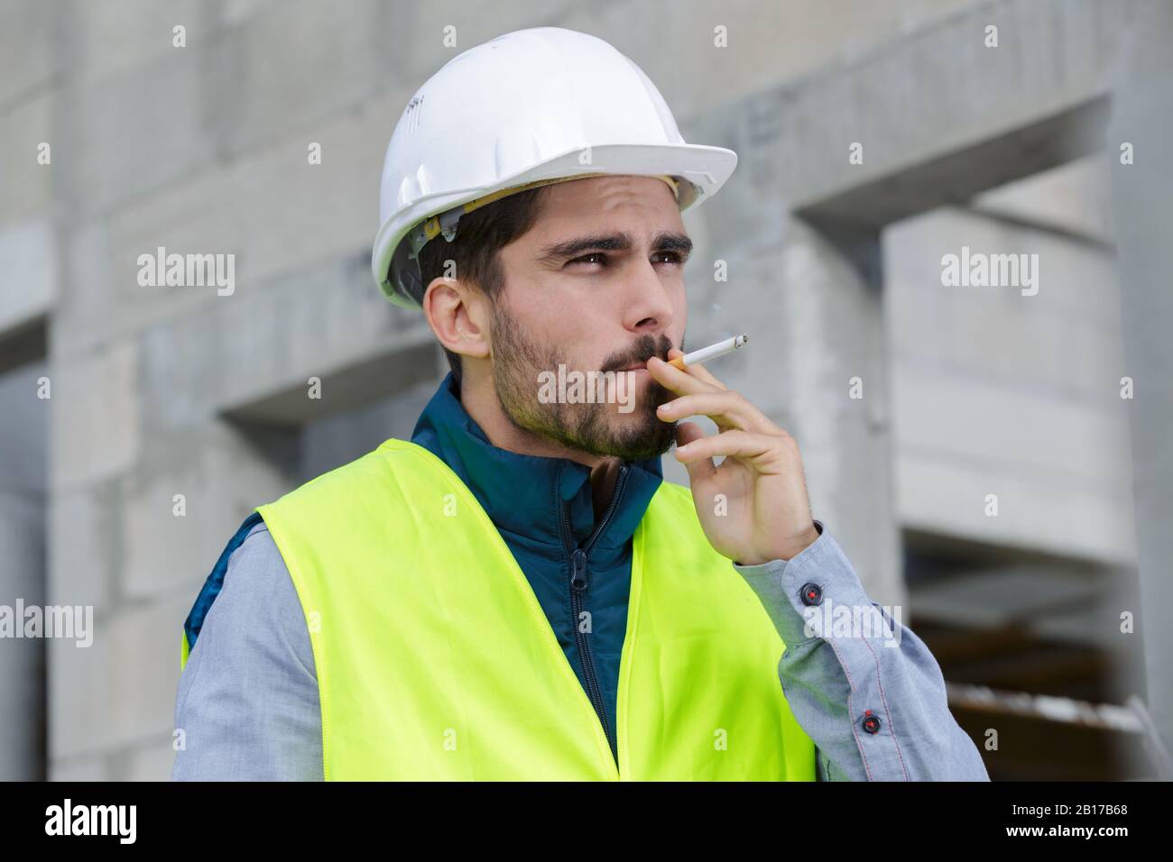 smoking cigarette on construction site Stock Photo - Alamy
