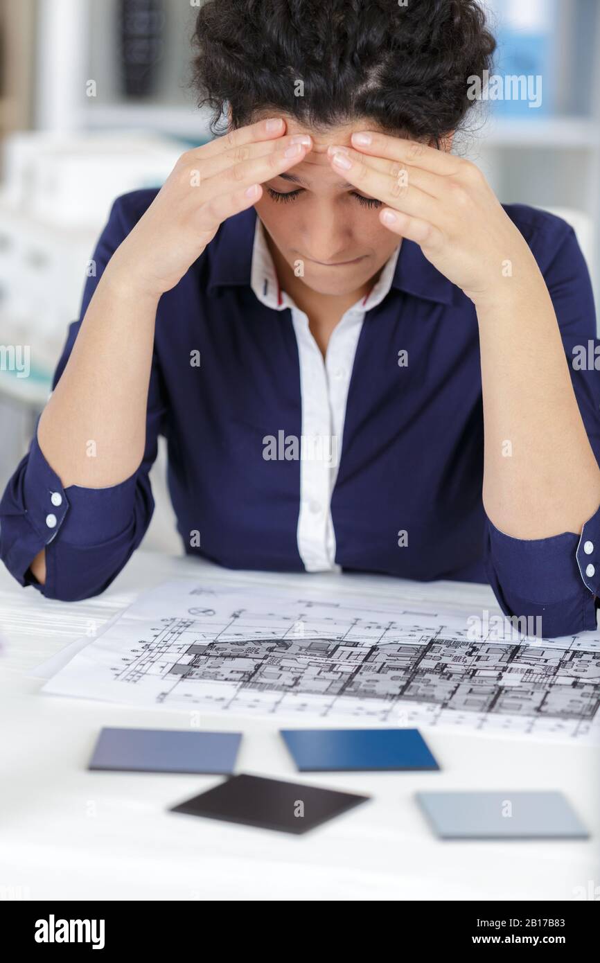 female architect stressed about her job Stock Photo - Alamy