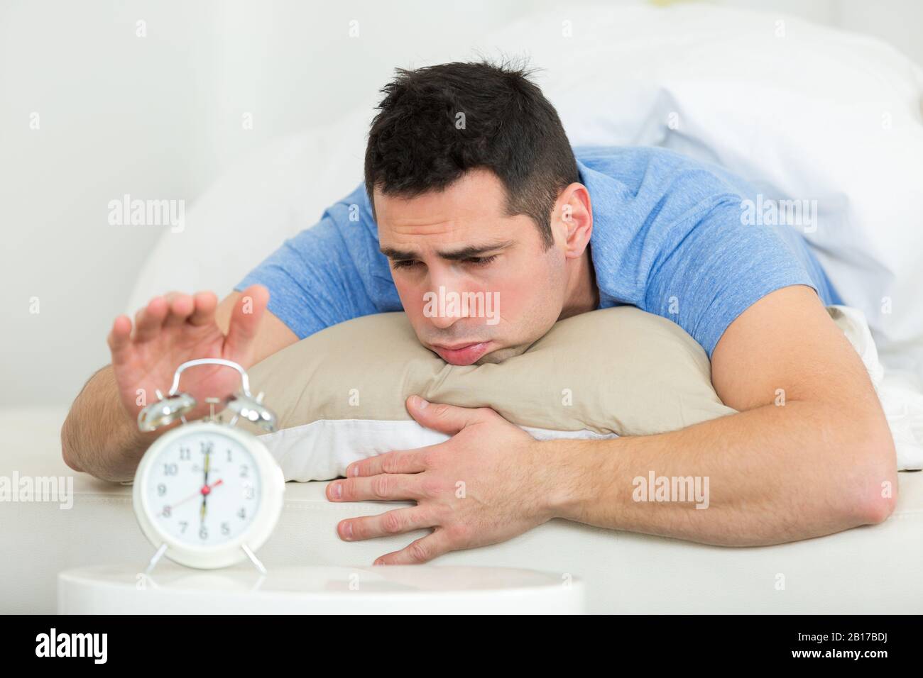 sad man does not want to wake up Stock Photo - Alamy