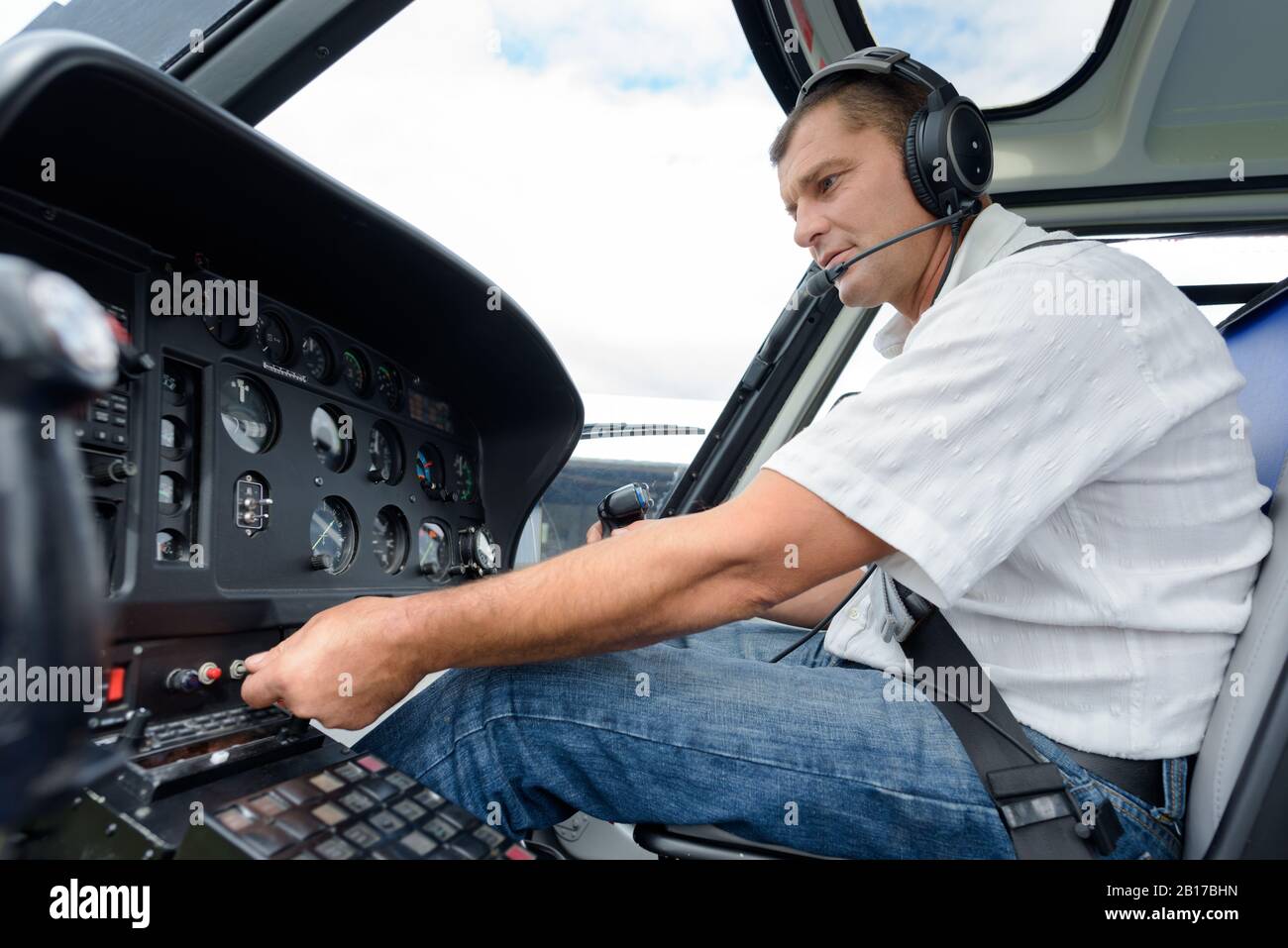 pilot in cockpit of helicopter during flight Stock Photo - Alamy