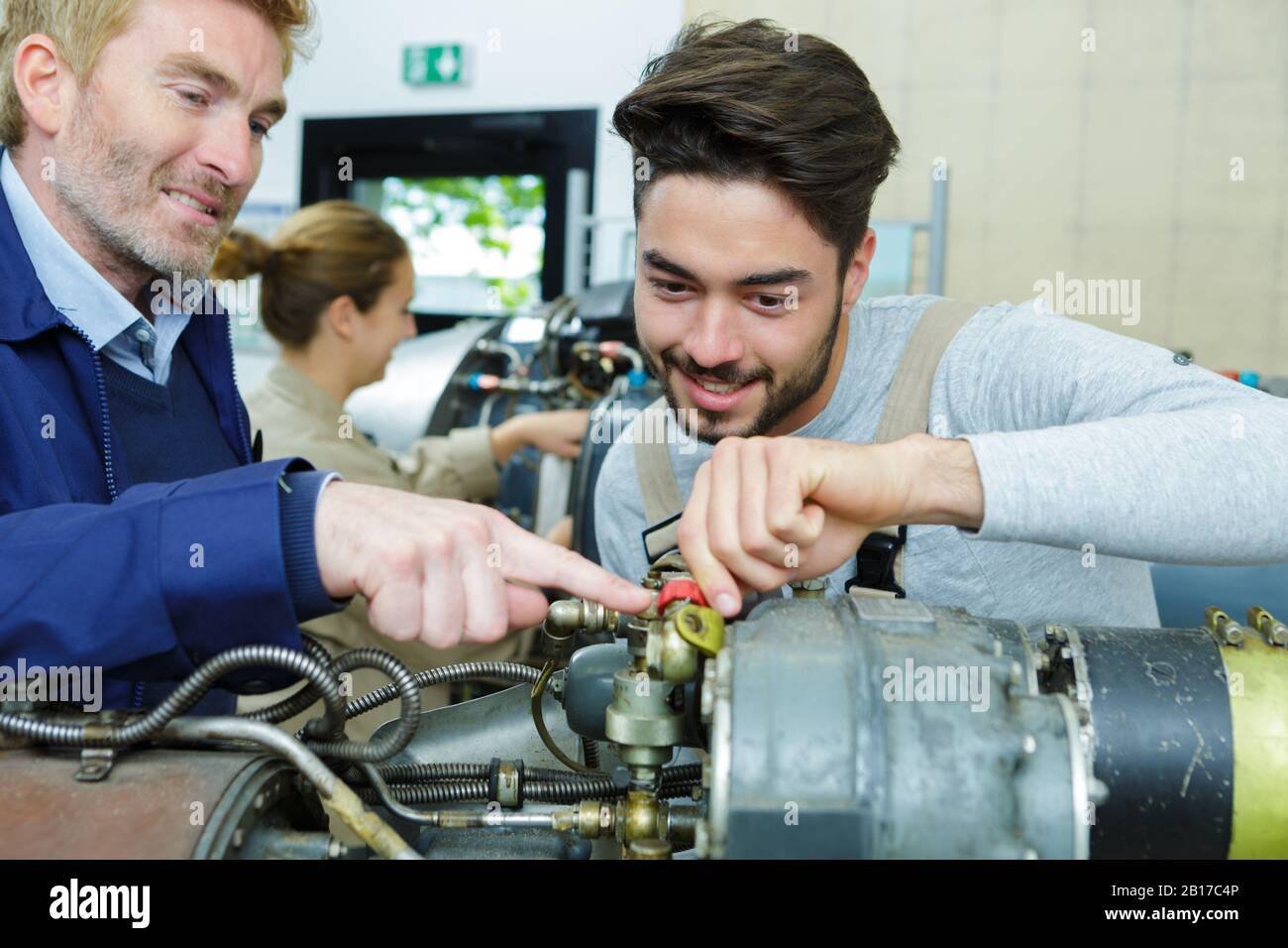happy apprentice learning about work Stock Photo - Alamy