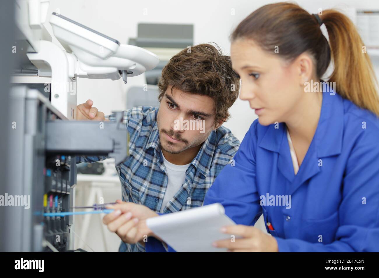 close up people during printer maintenance Stock Photo - Alamy