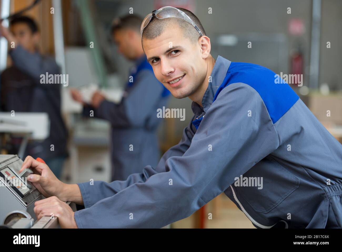 industrial manufacturing operator smiling and posing Stock Photo - Alamy