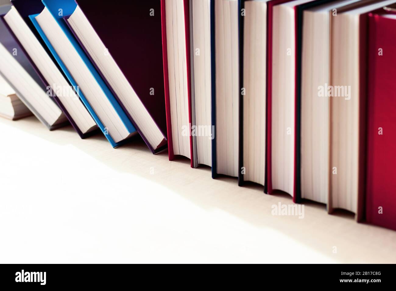 Collected edition books standing in a row Stock Photo - Alamy