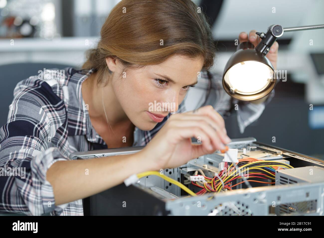 female technician working with transistor Stock Photo - Alamy