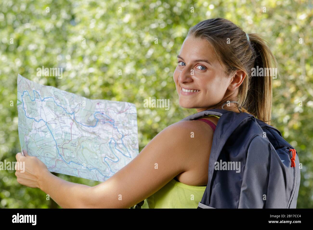 women hiker looking at map Stock Photo - Alamy