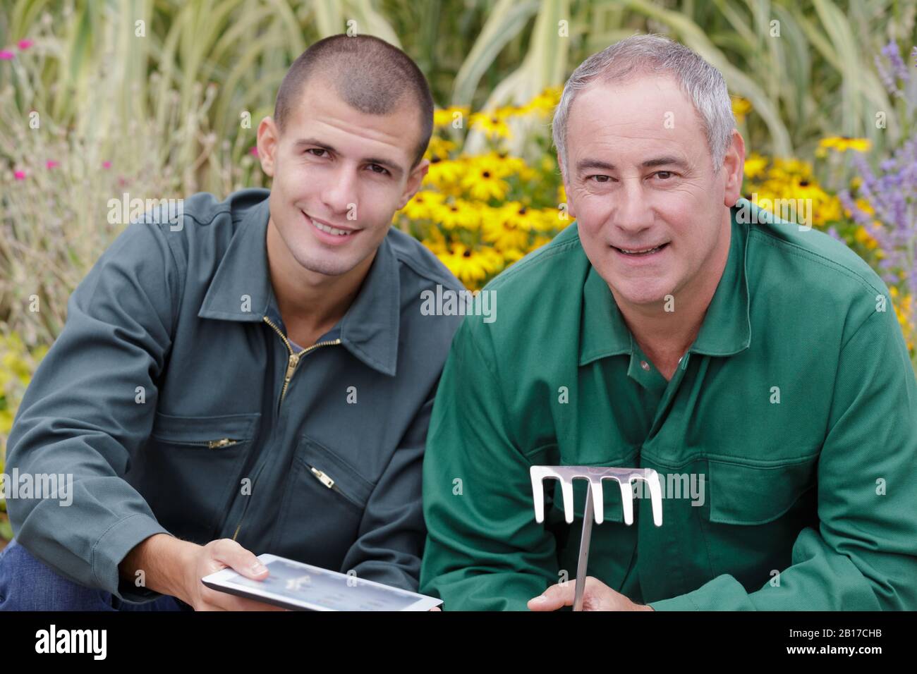 portrait of two happy gardeners Stock Photo - Alamy