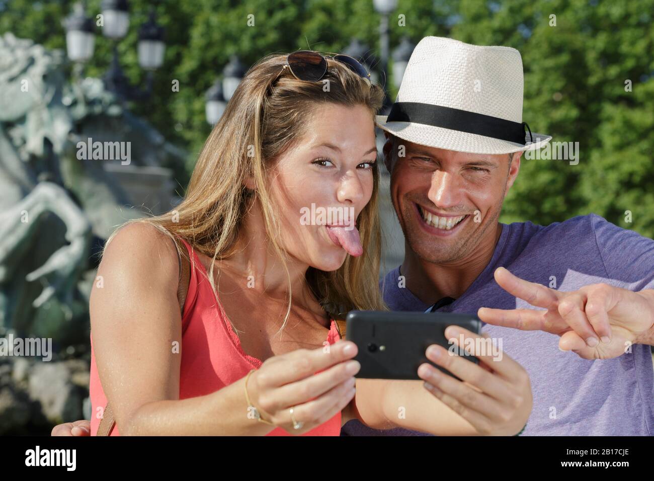 young couple doing wacky selfie Stock Photo - Alamy
