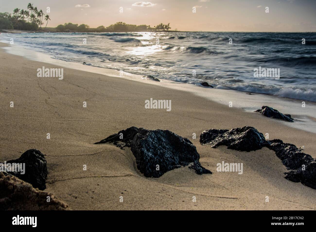 Hawaiian Beach with Rocks Stock Photo - Alamy