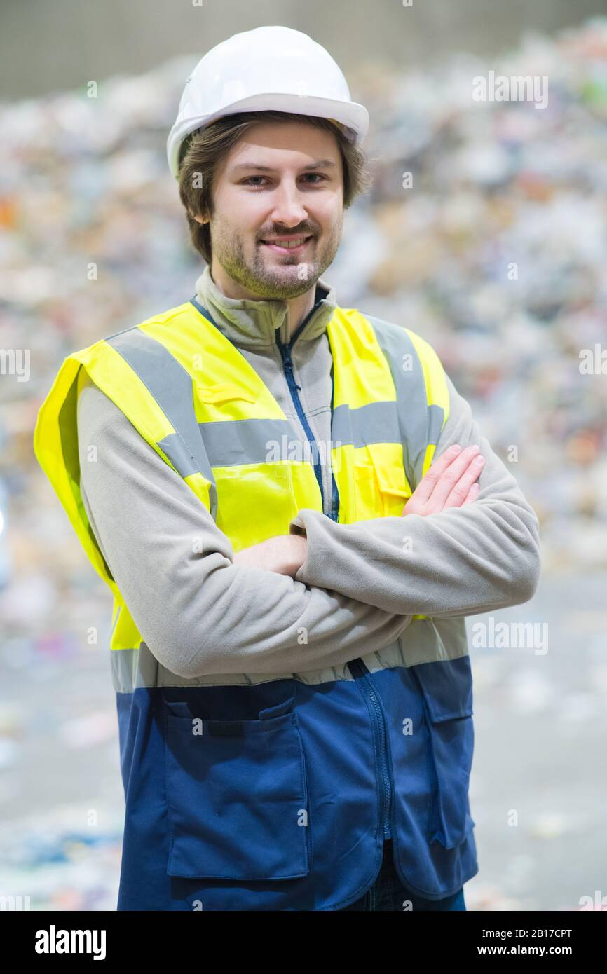 engineer standing in front of an factory building Stock Photo - Alamy
