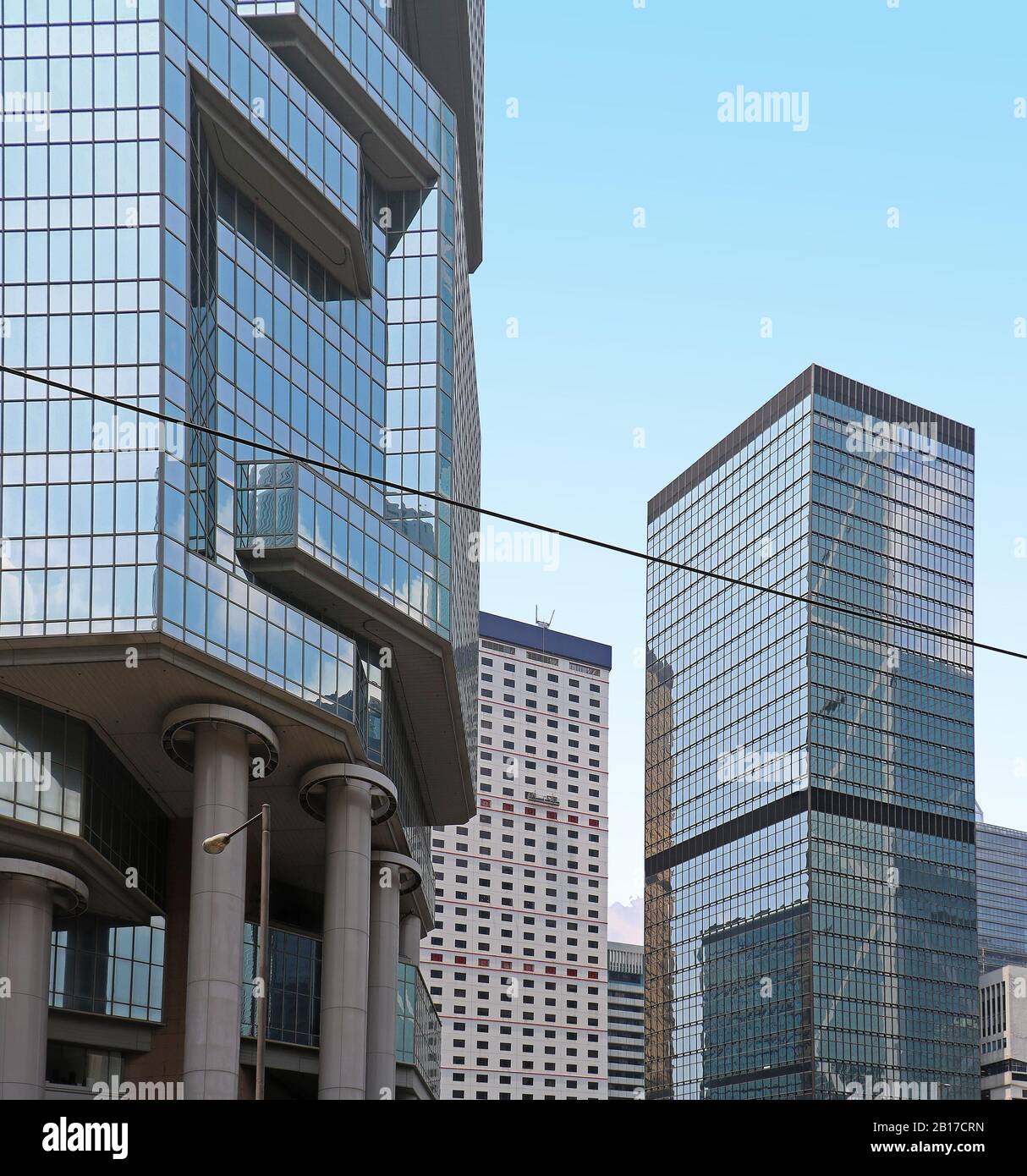 Modern tall buildings with blue glass facades in Hong Kong Stock Photo ...