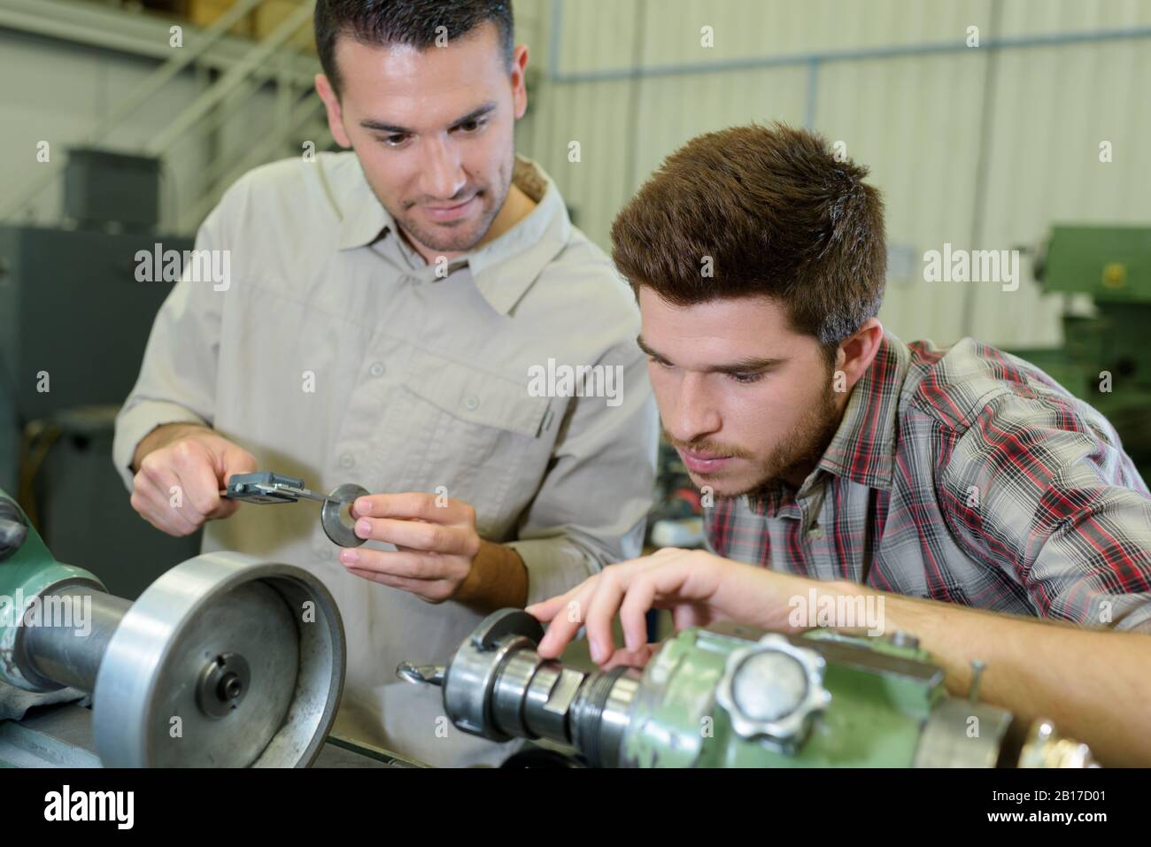 mechanical engineering student connecting mechanical parts Stock Photo ...