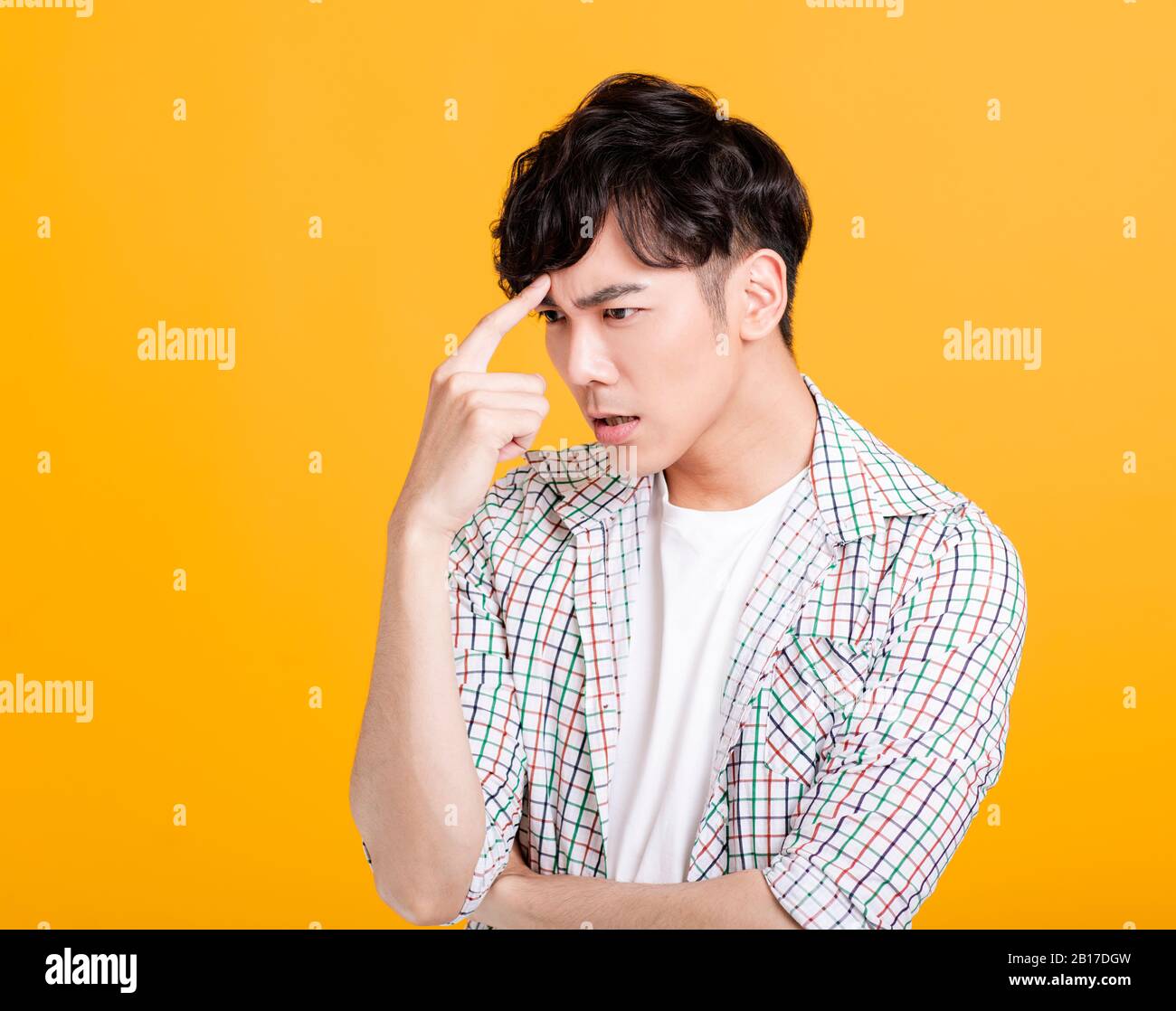 angry asian young man thinking Stock Photo - Alamy