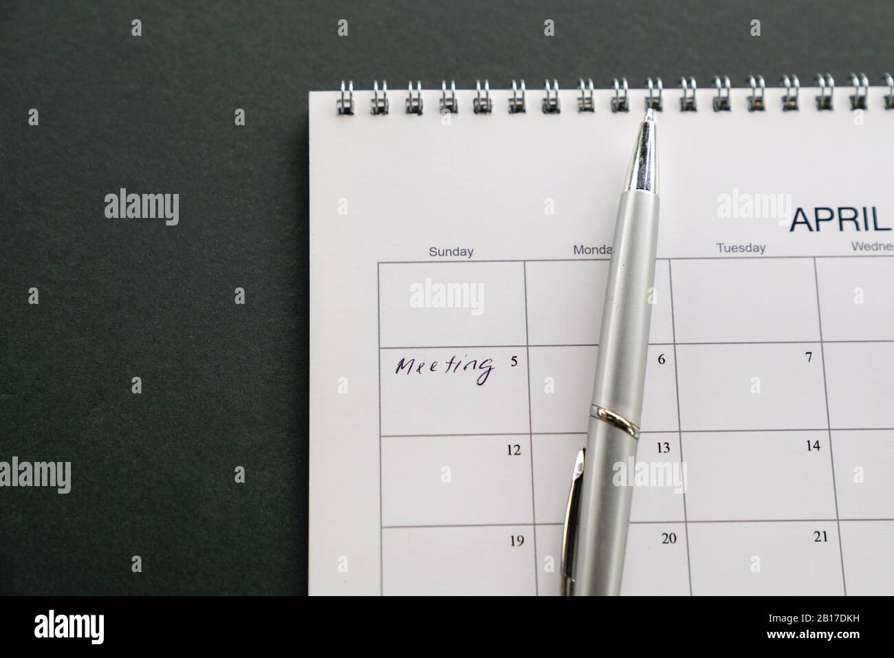 White clean calendar on black background with copy space. Words ...