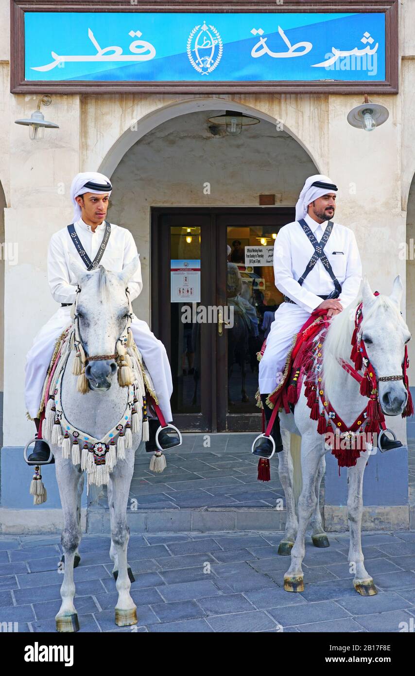 DOHA, QATAR -12 DEC 2019- View of Qatari mounted police on horses on the street at the Souq ...