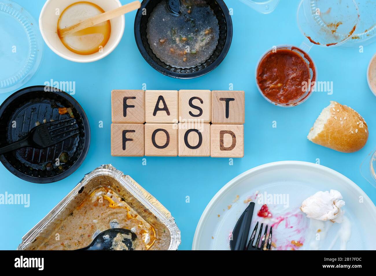 the inscription on a blue background "fast food" top view. empty ...